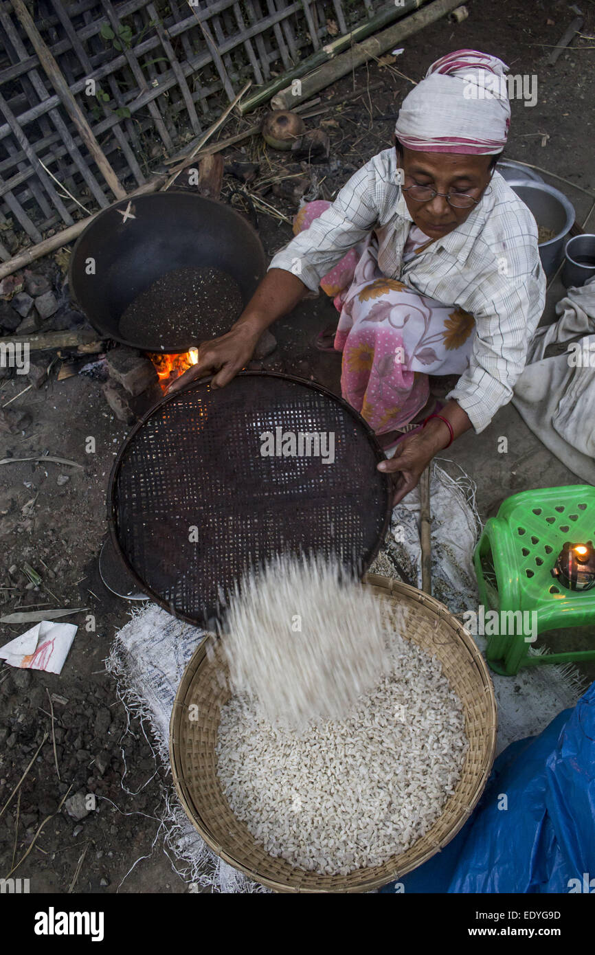 Sivasagar, Assam, India. 12th Jan, 2015. A woman prepares 'Hurum' - a ...