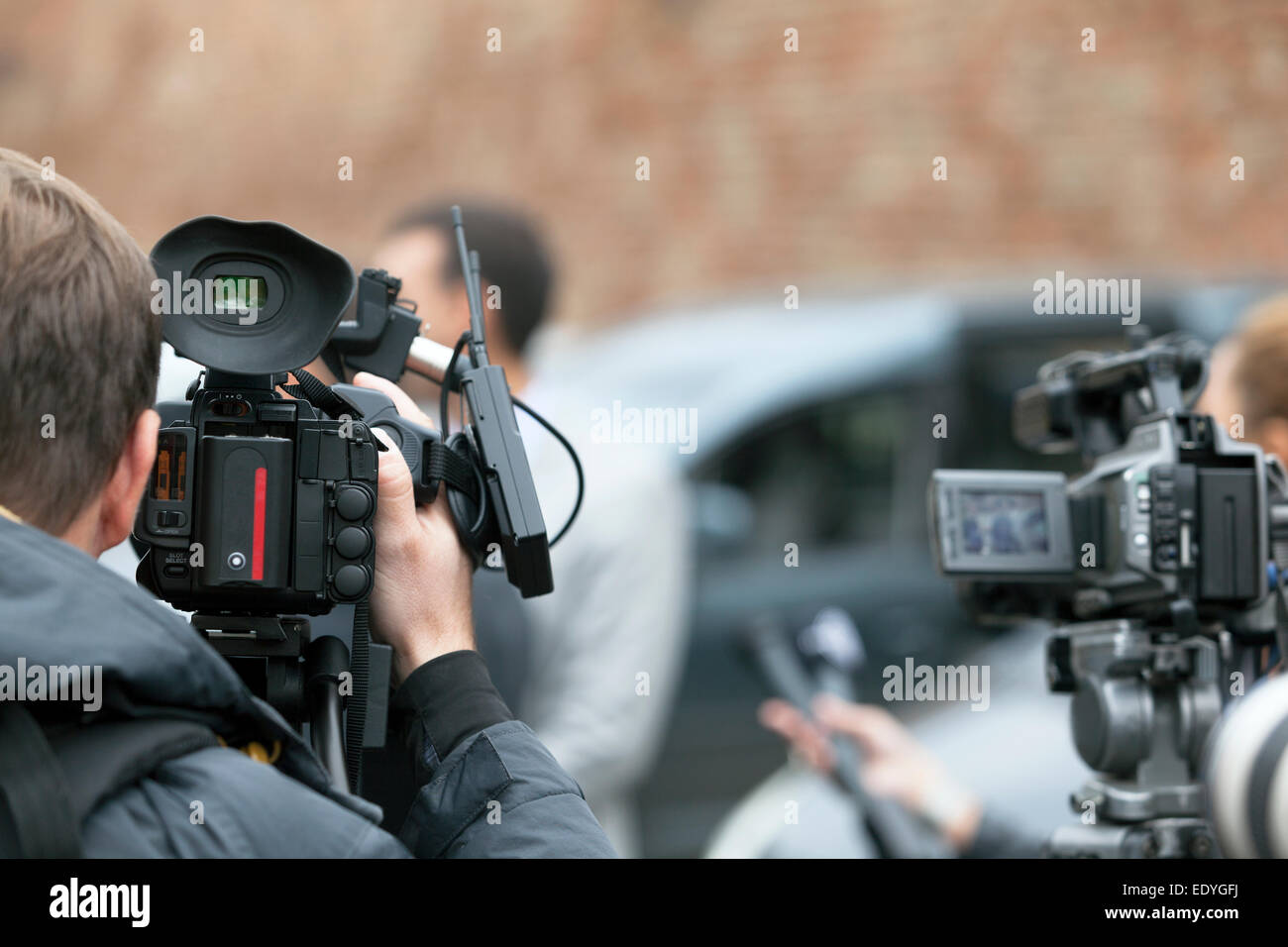 filming an event with a video camera Stock Photo - Alamy