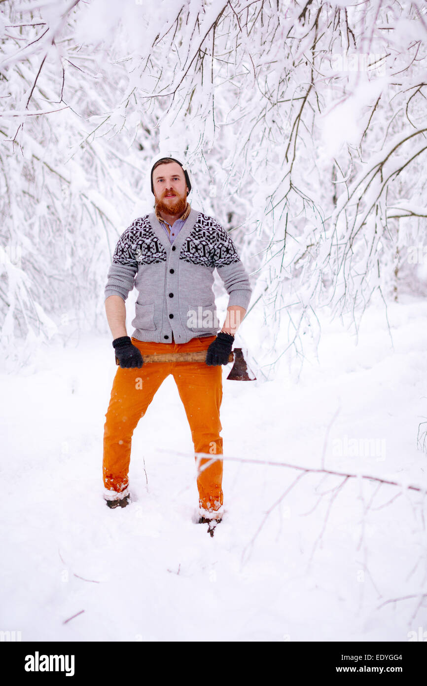 Lumberjack in the snowy winter forest Stock Photo - Alamy