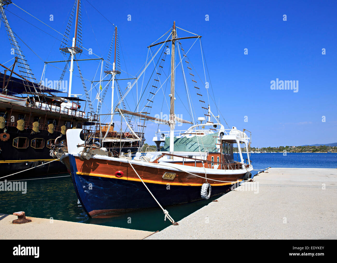 Ships in the harbor of Ormos Panagias Stock Photo - Alamy