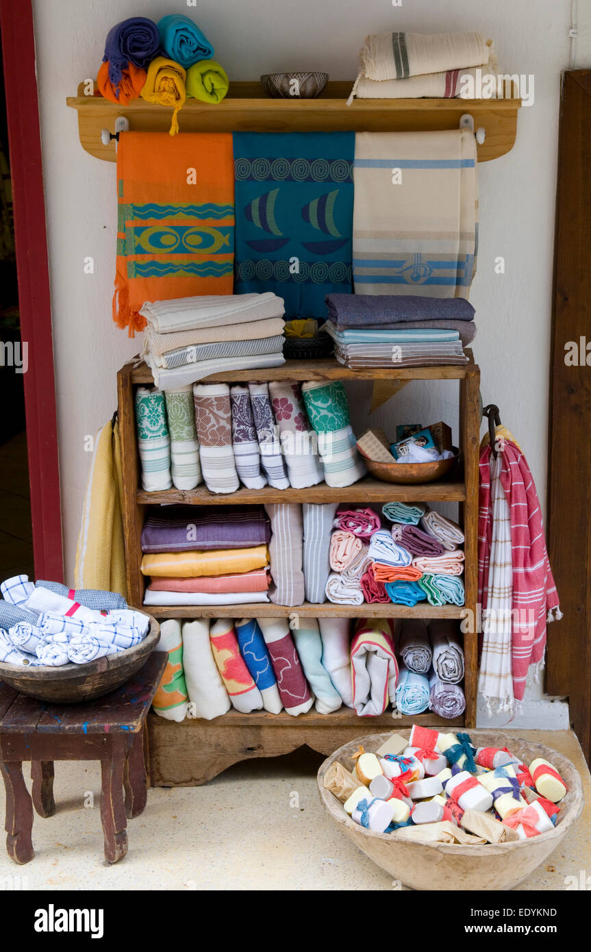 Natural traditional clothes and soap lay out for sell. The counter is ...