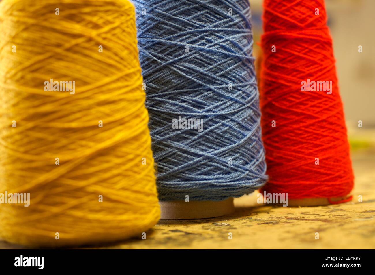 shot of large balls of wool on bobbins Stock Photo - Alamy
