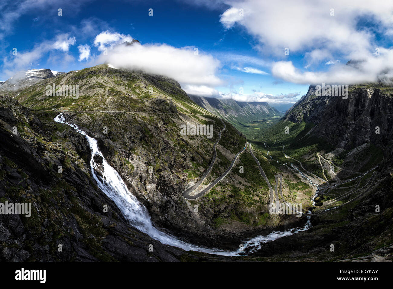 Waterfall with the Trollstigen serpentine mountain road, Trollstigen ...