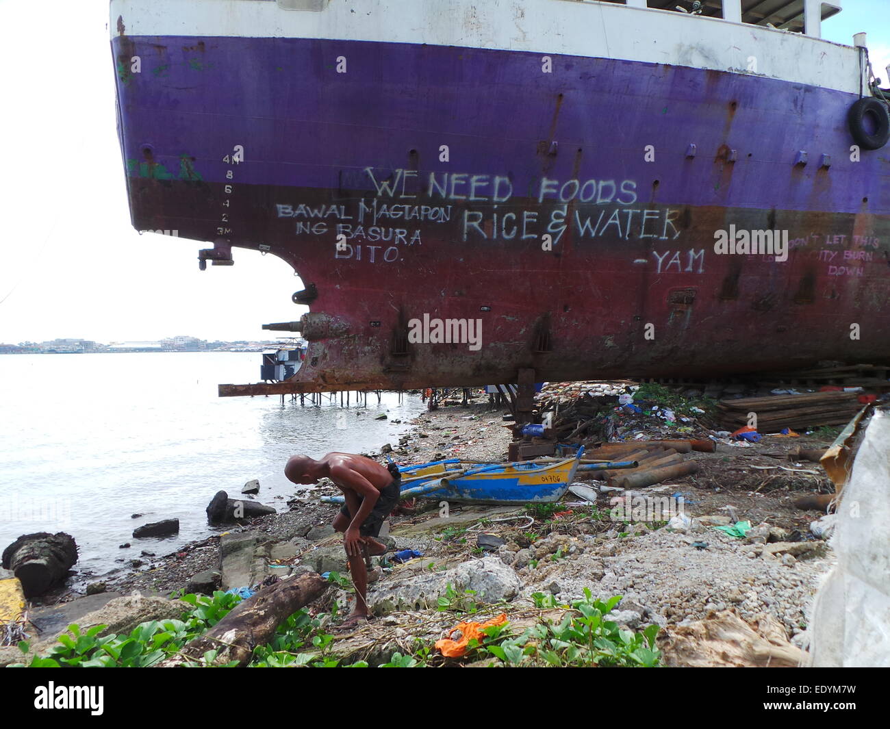 A man scavenging for metals and steels at the ship wreackage site in ...