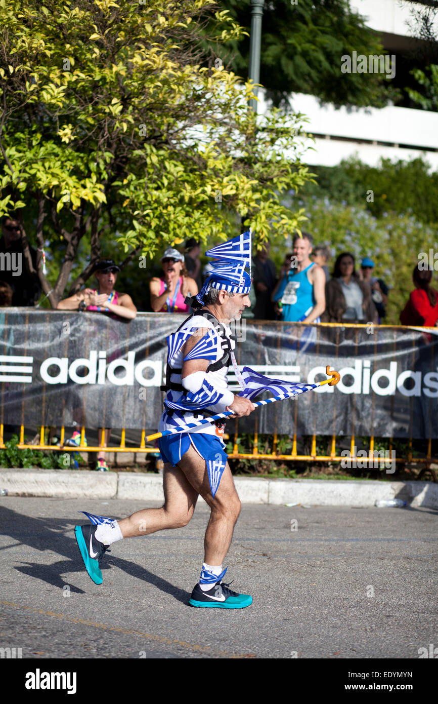 A Greek marathon runner at the street of Athens as he runs the ...