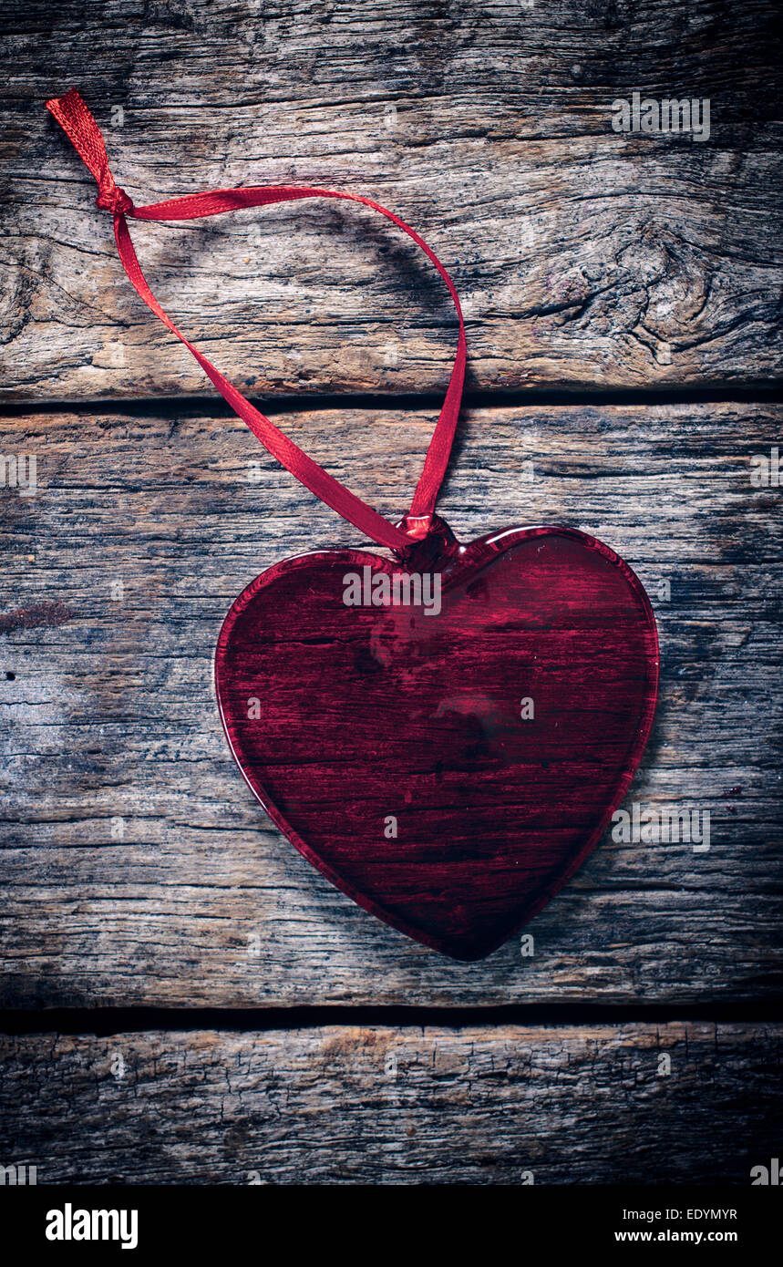 Hear shape object on wooden background Stock Photo - Alamy