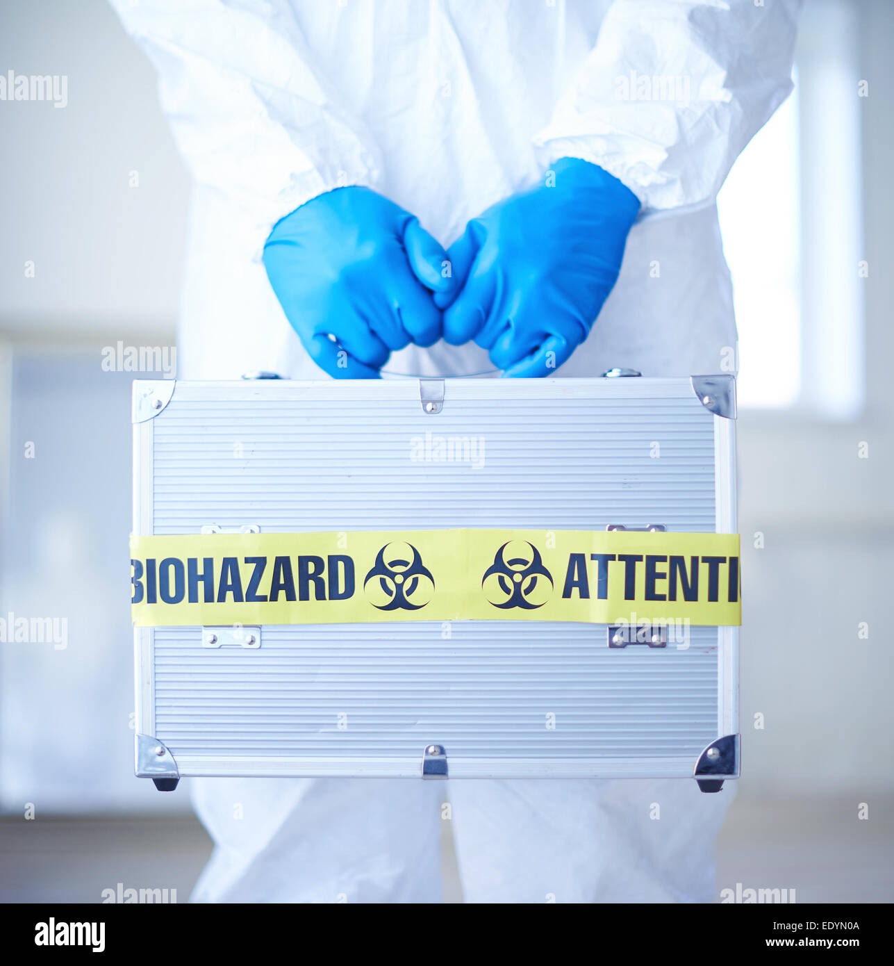 Close-up of medical case with biohazard symbol in scientist gloved ...