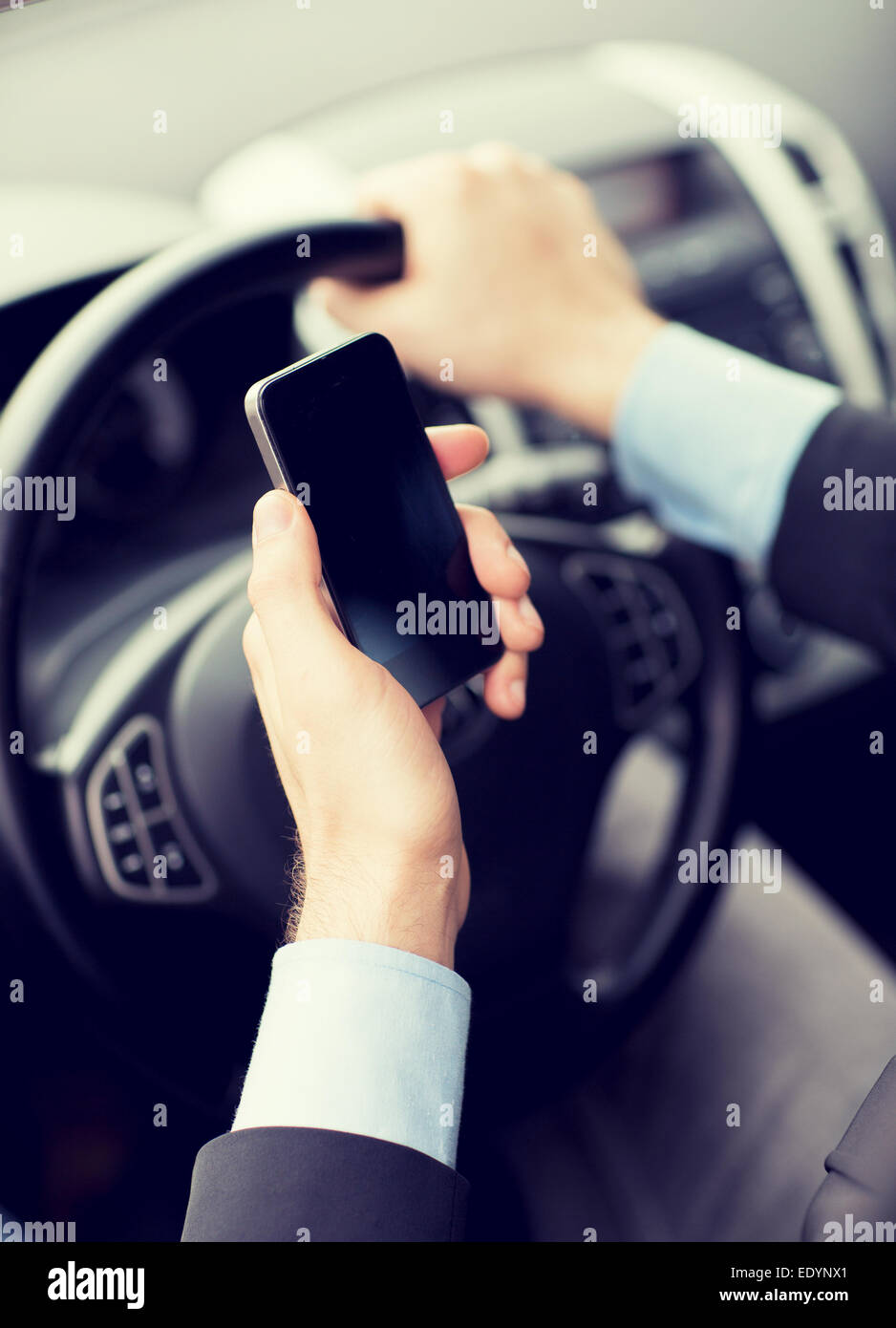 man using phone while driving the car Stock Photo - Alamy