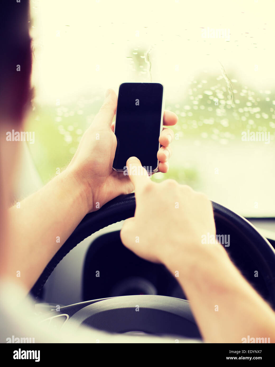 man using phone while driving the car Stock Photo - Alamy