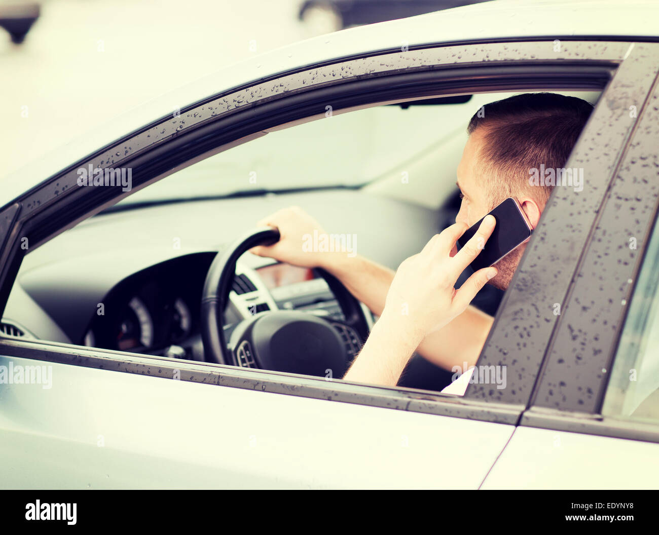 man using phone while driving the car Stock Photo - Alamy