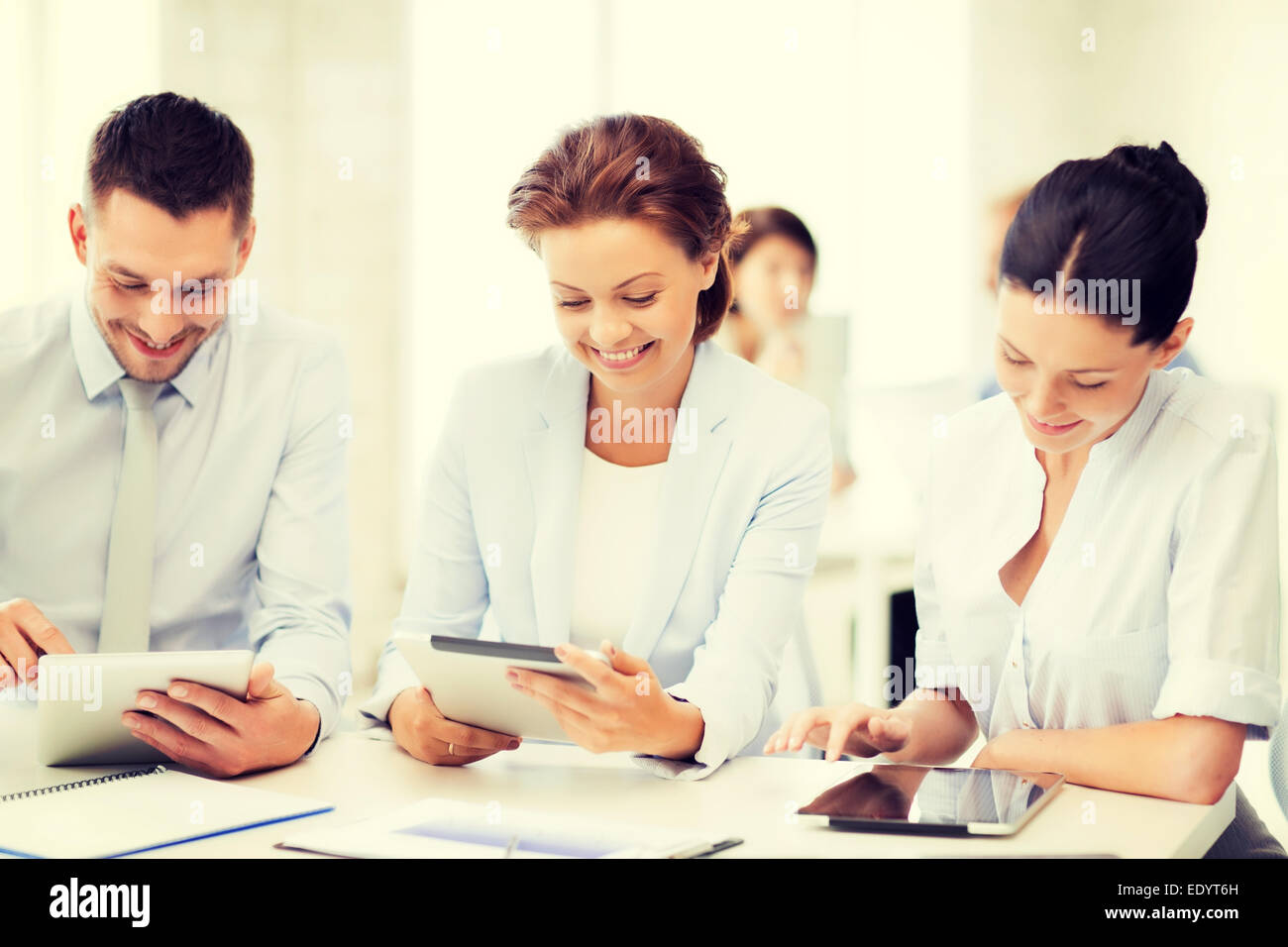 business team working with tablet pcs in office Stock Photo - Alamy