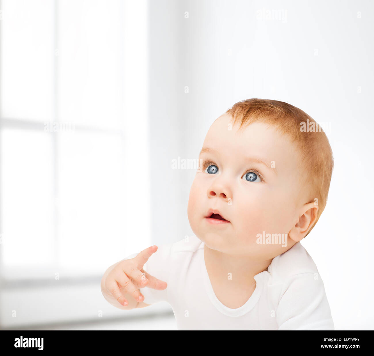 curious baby looking up Stock Photo - Alamy