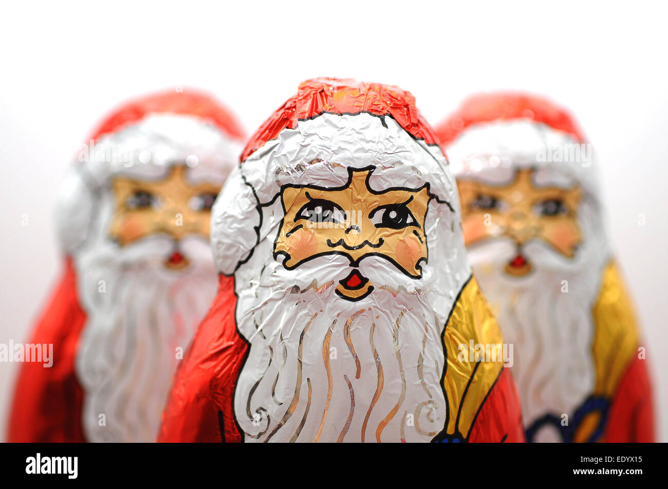 Three chocolate Santas Stock Photo - Alamy