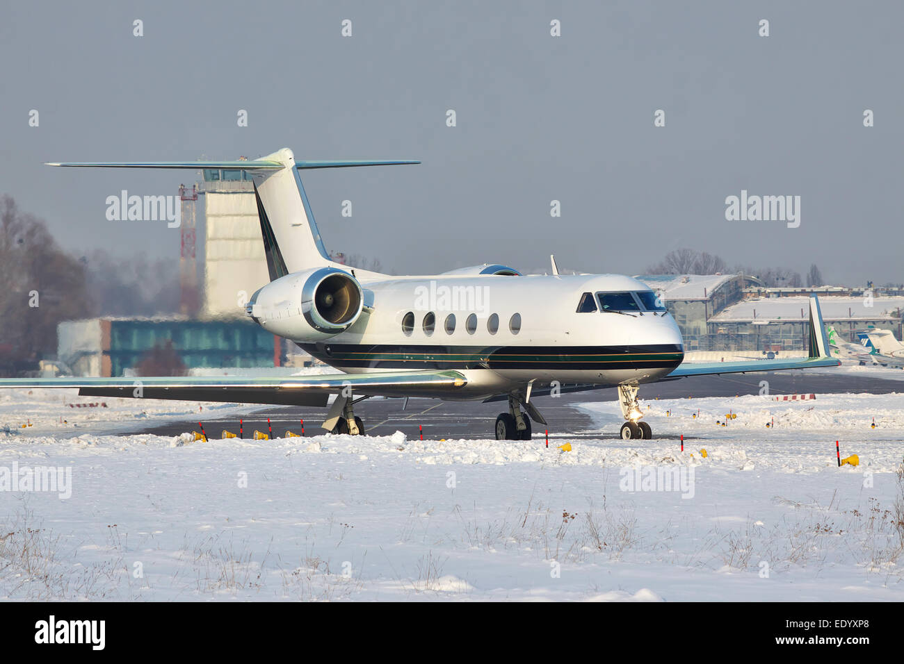 Business jet taxiing to the runway in winter Stock Photo - Alamy