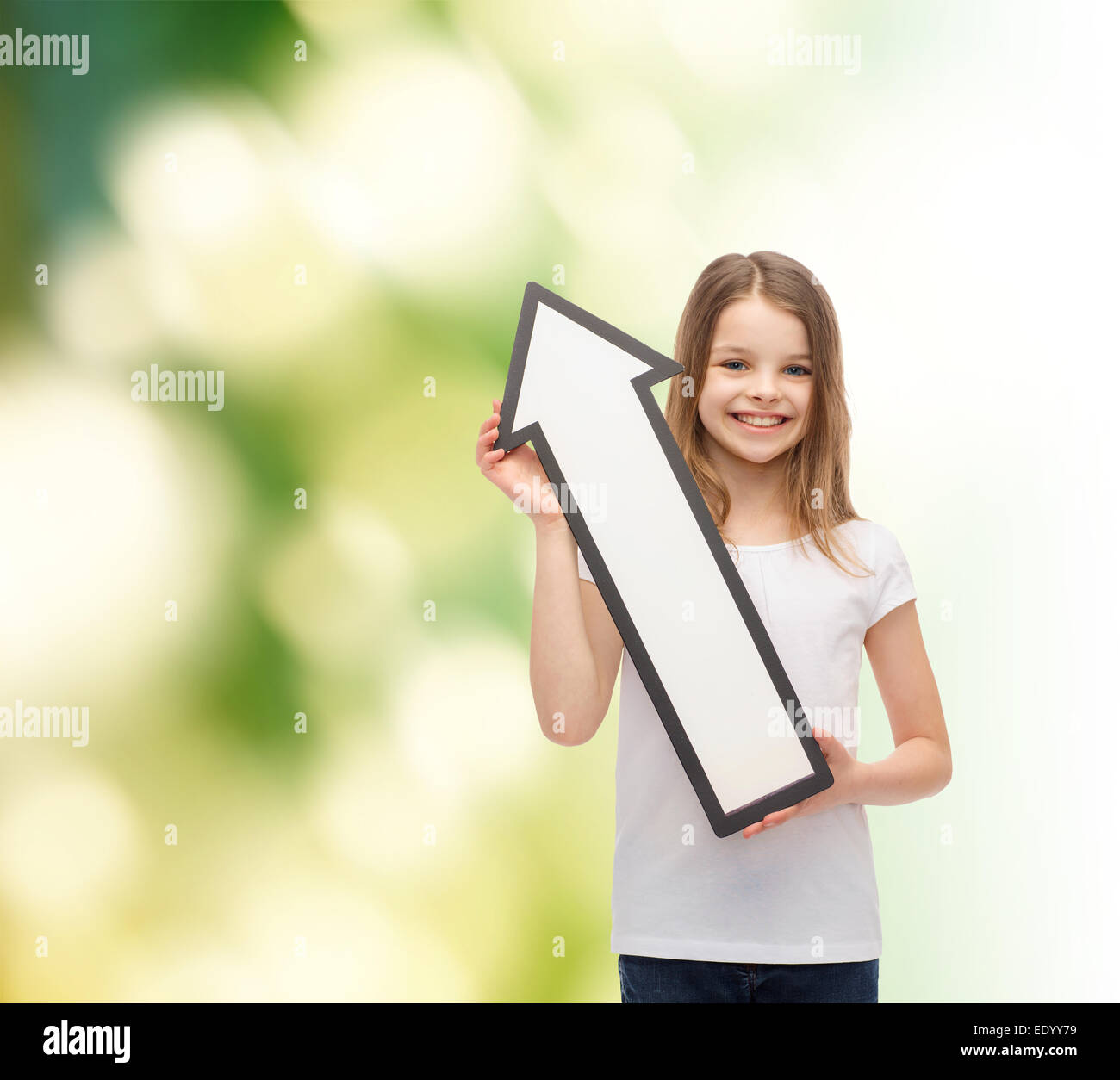 smiling little girl with blank arrow pointing up Stock Photo - Alamy