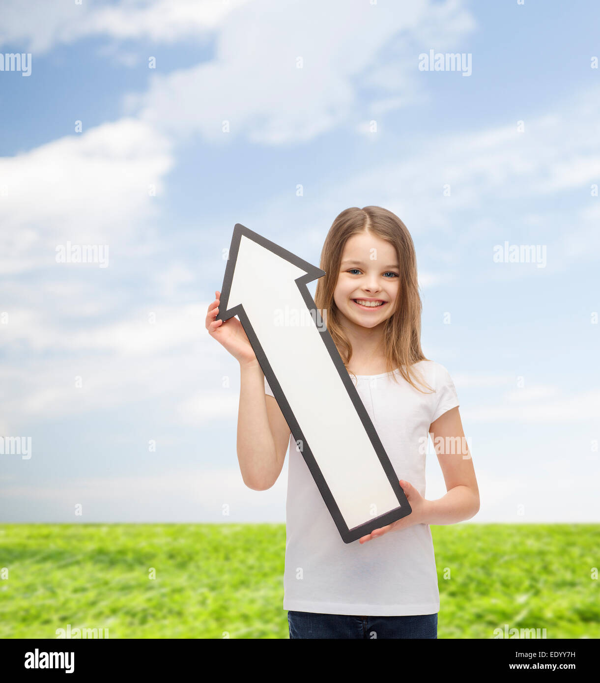 smiling little girl with blank arrow pointing up Stock Photo - Alamy