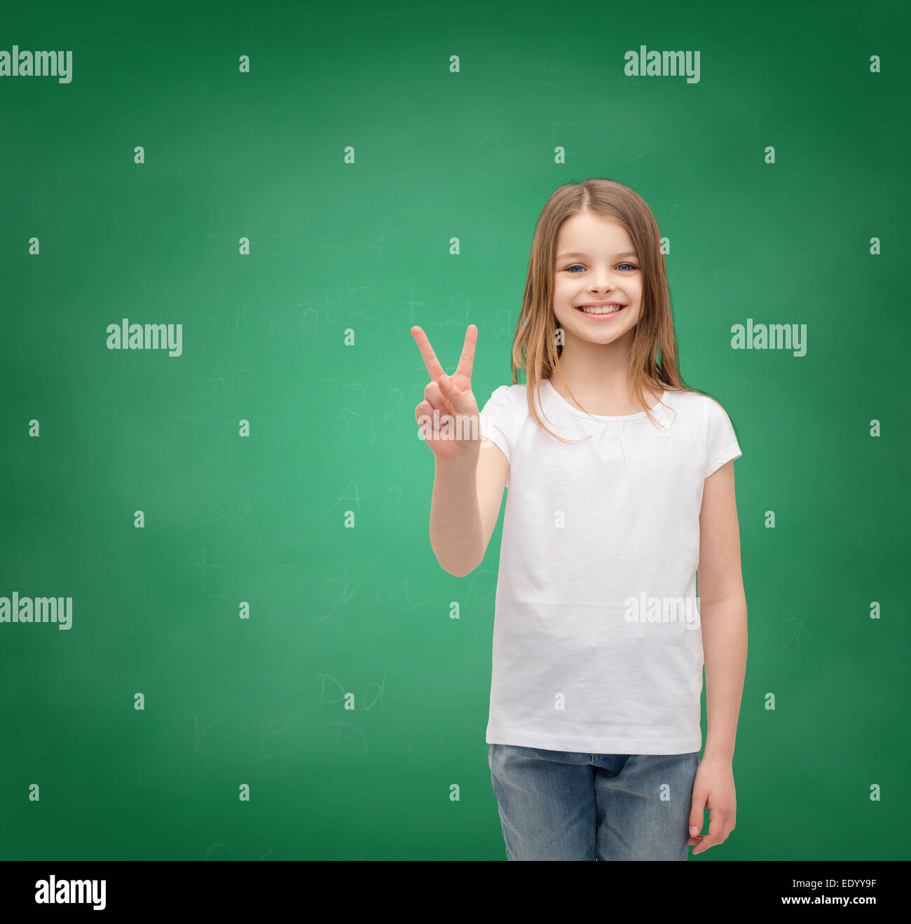 little girl in white t-shirt showing peace gesture Stock Photo - Alamy