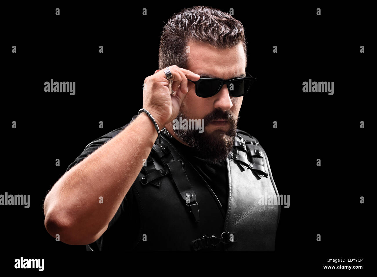 Biker with sunglasses looking at the camera on black background Stock ...