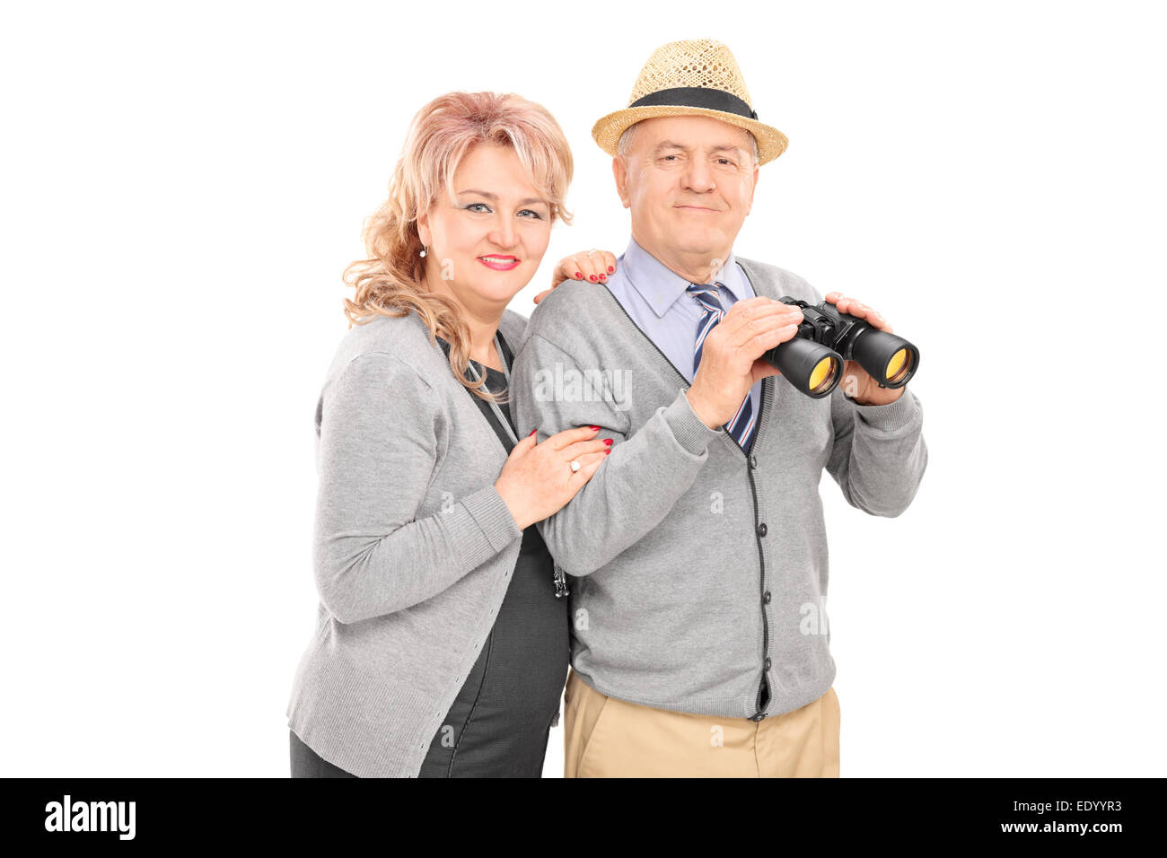 Mature couple posing with binoculars isolated on white background Stock ...