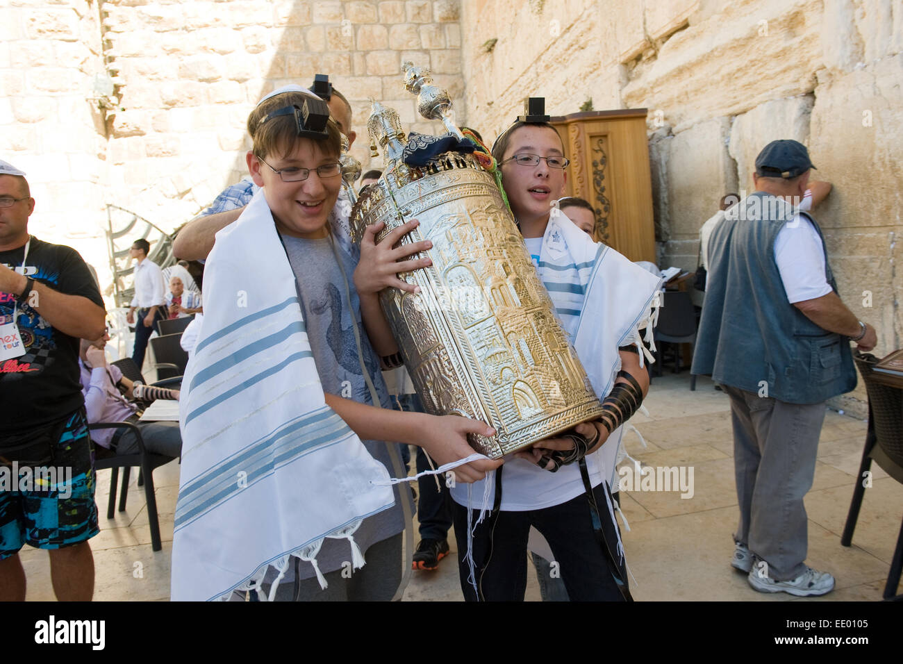 Two 13 years old boys are carrying a torah scroll during a Bar Mitzvah ...