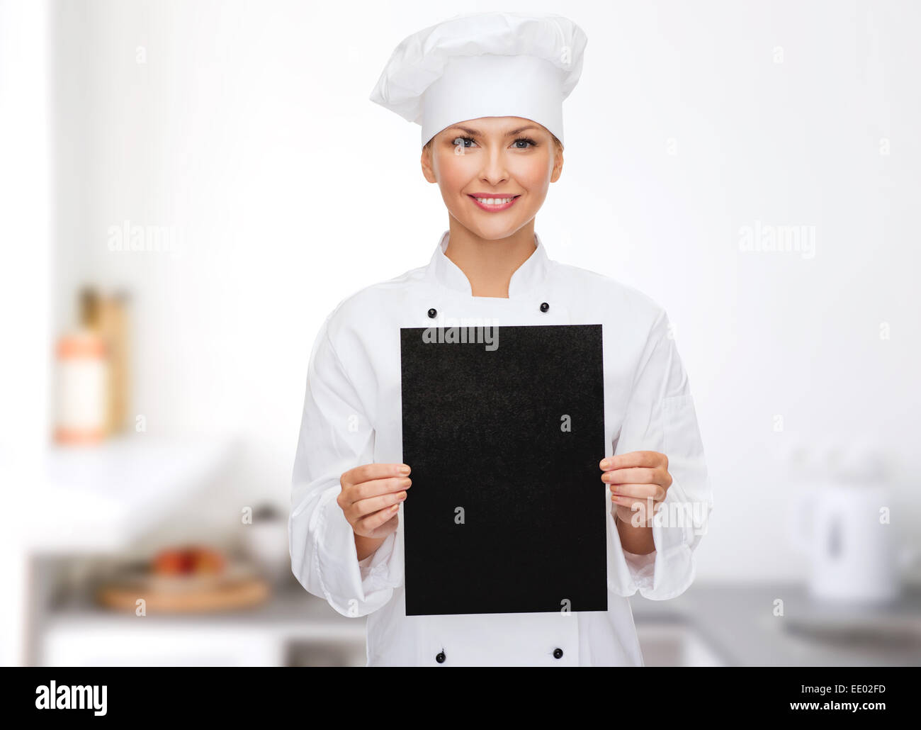 smiling female chef with black blank paper Stock Photo - Alamy