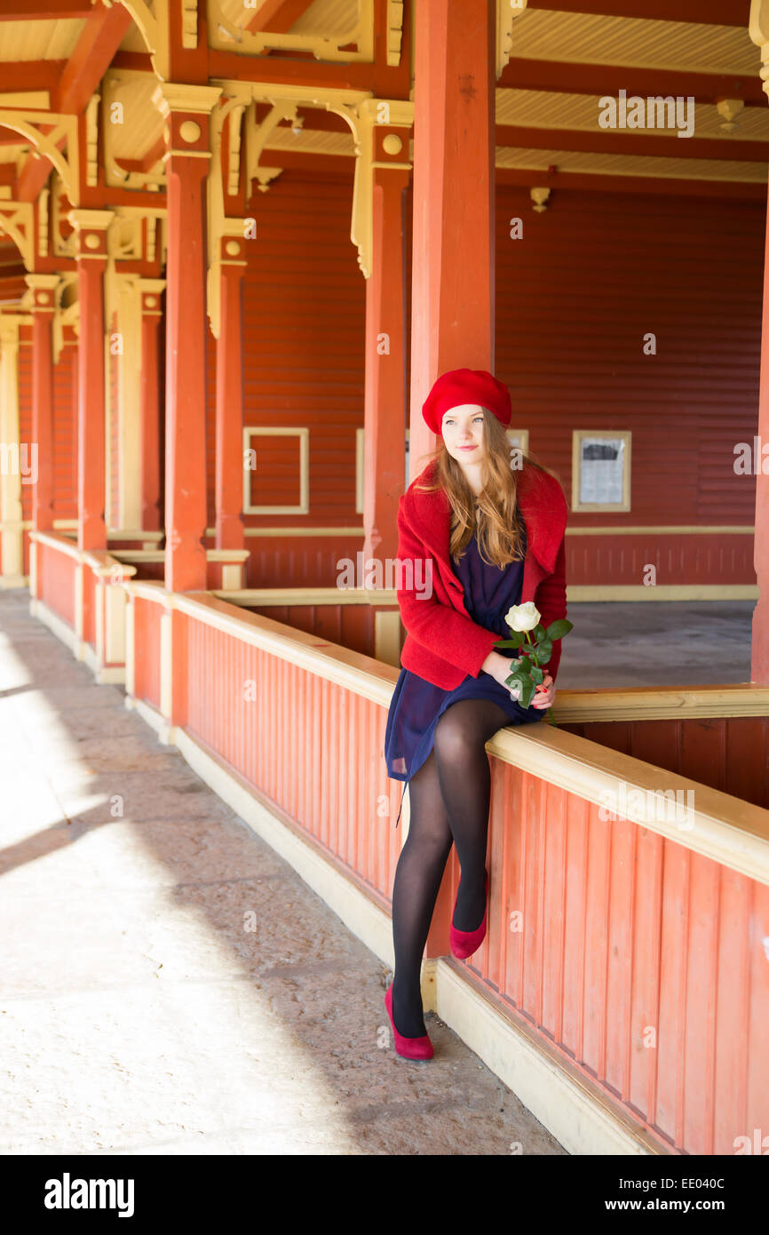 Woman on local station boundaries hold white rose Stock Photo - Alamy