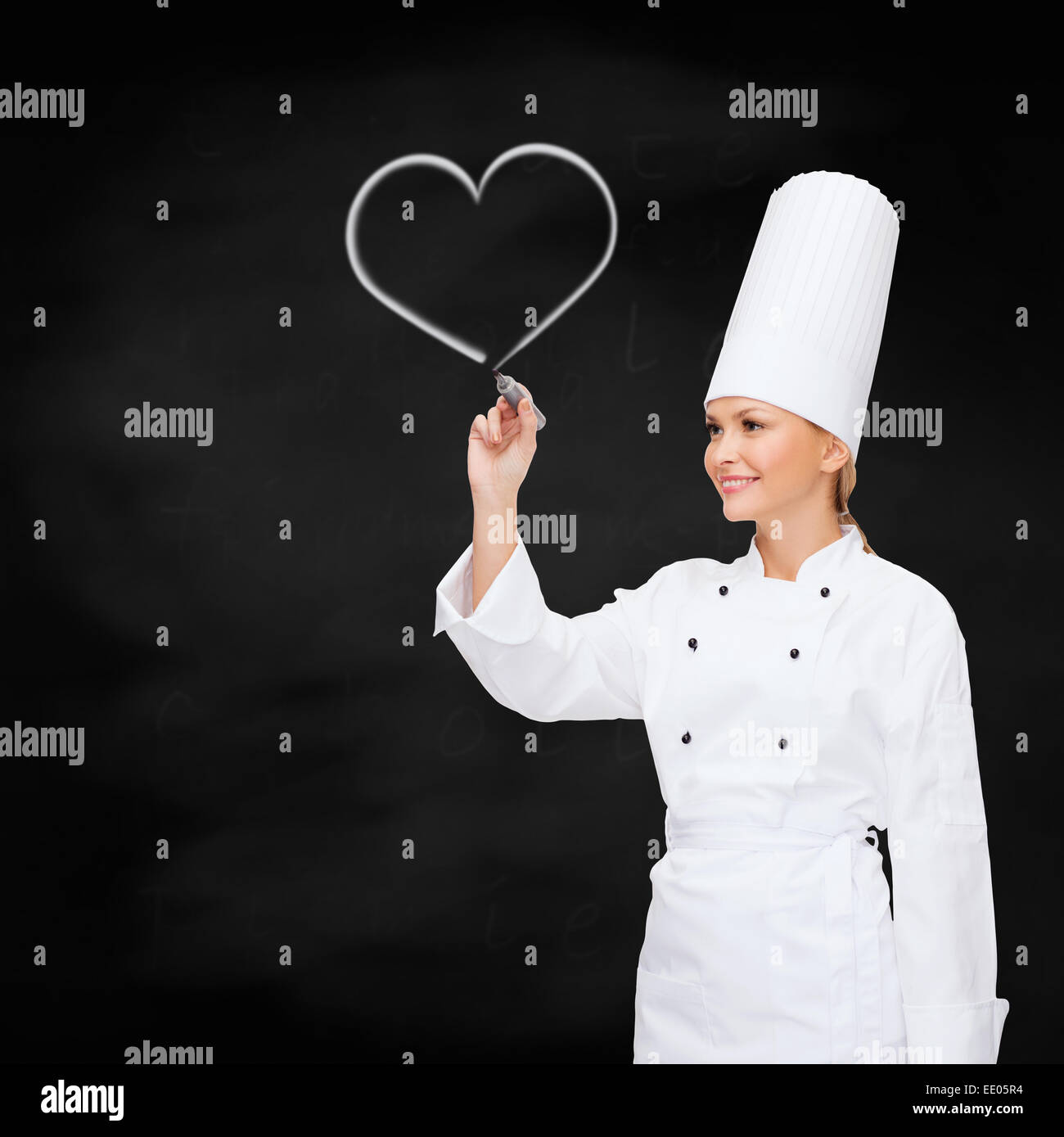 smiling female chef writing something on air Stock Photo - Alamy