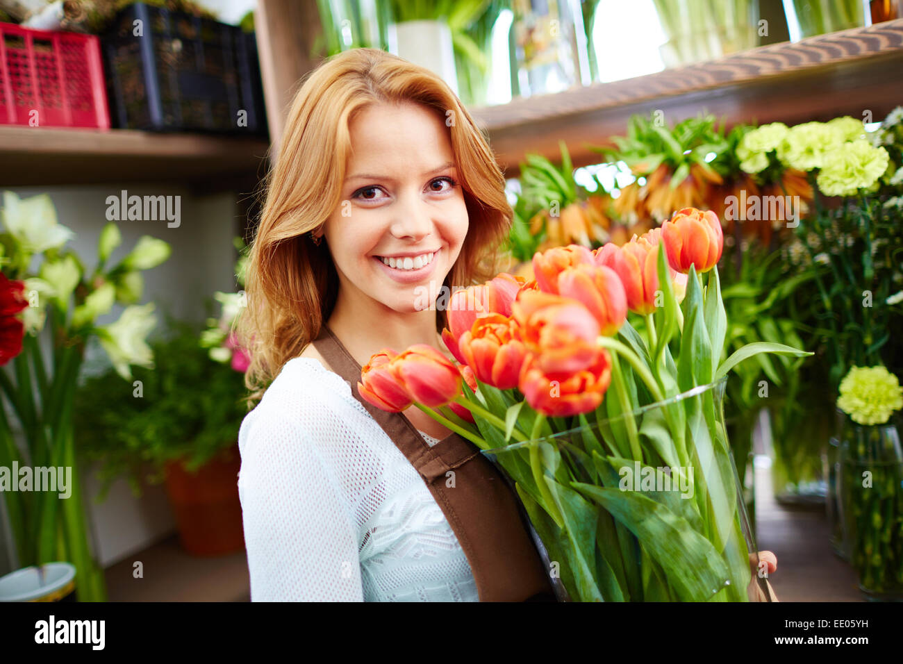 Female grower of flowers looking at camera Stock Photo - Alamy