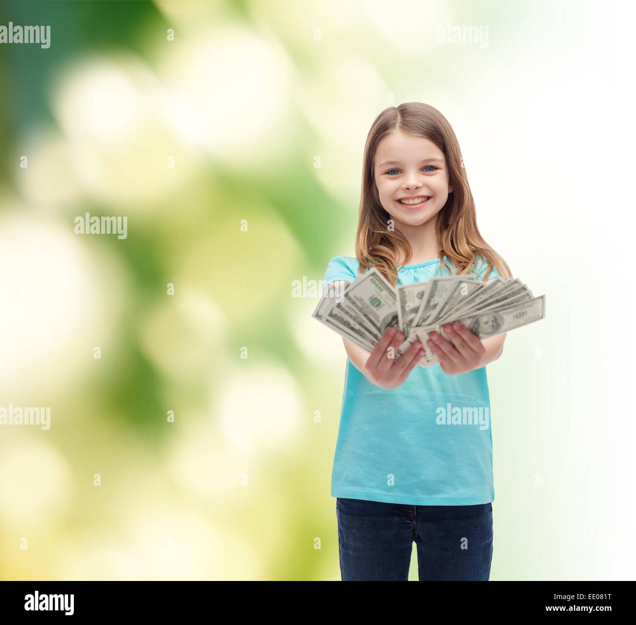 smiling little girl giving dollar cash money Stock Photo - Alamy