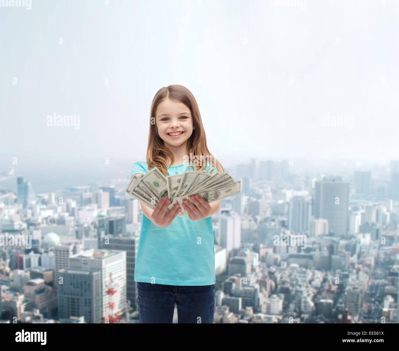 smiling little girl giving dollar cash money Stock Photo - Alamy