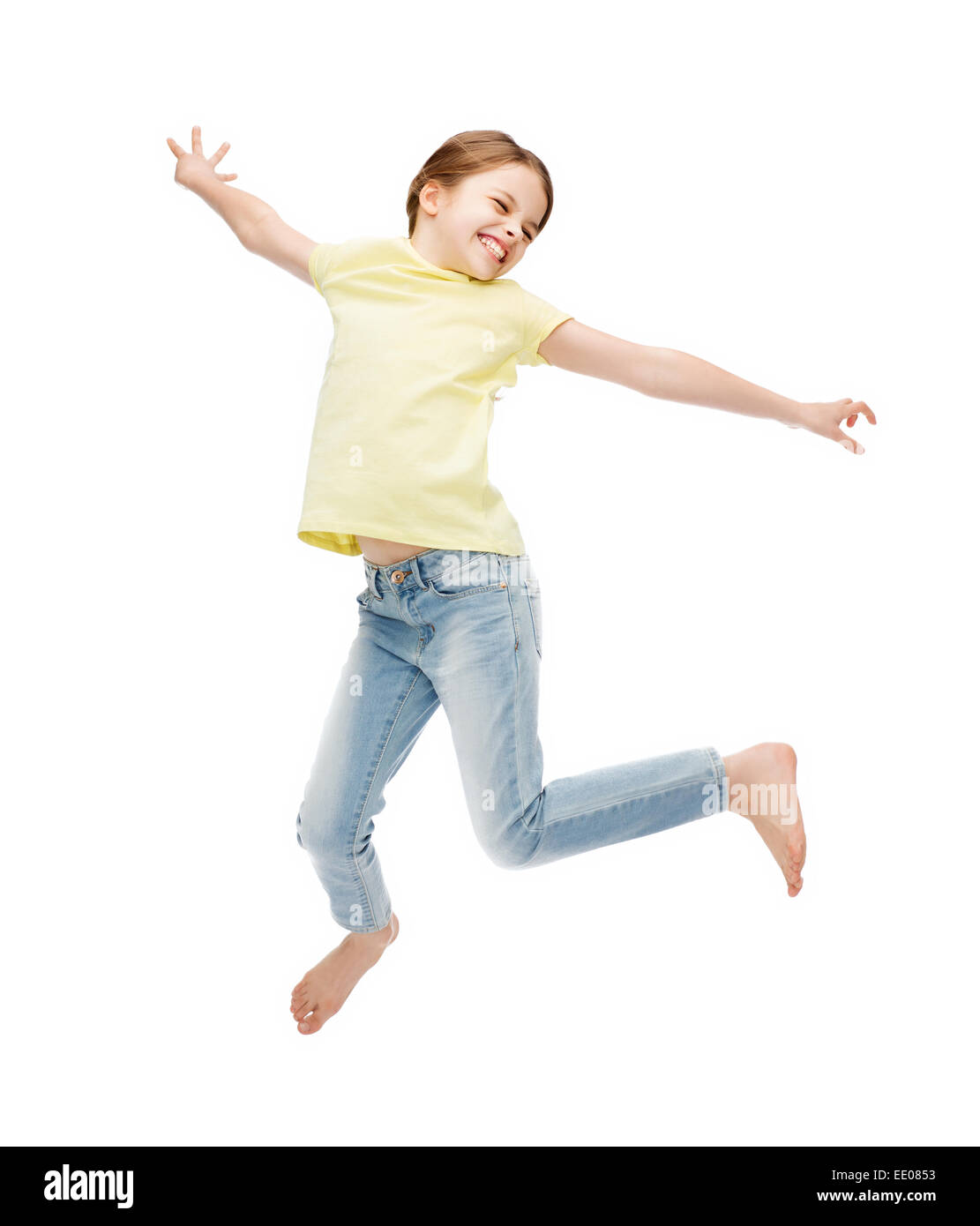 smiling little girl jumping Stock Photo - Alamy