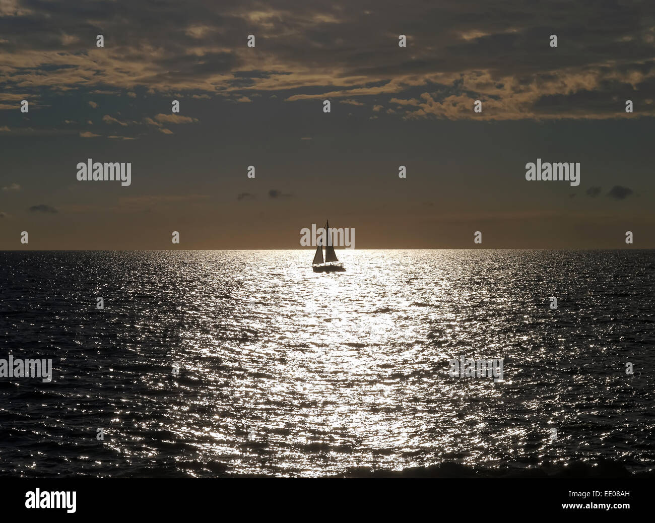 summer sundown and sailboat on the ocean Stock Photo - Alamy