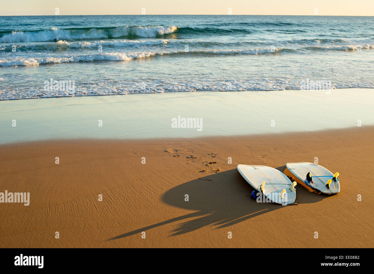 Surfboard lying on beach hi-res stock photography and images - Alamy
