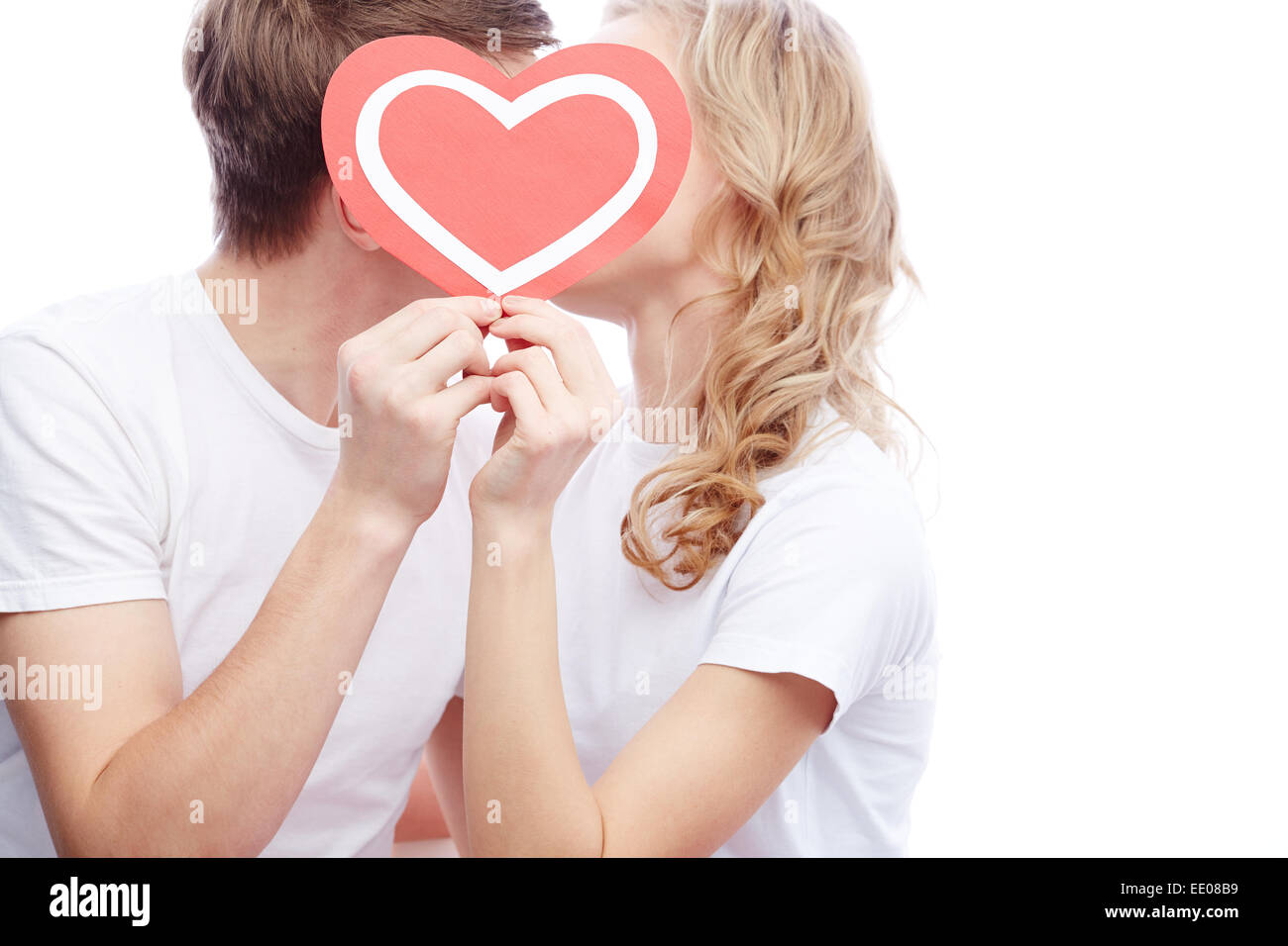 Kissing couple with a heart Stock Photo - Alamy