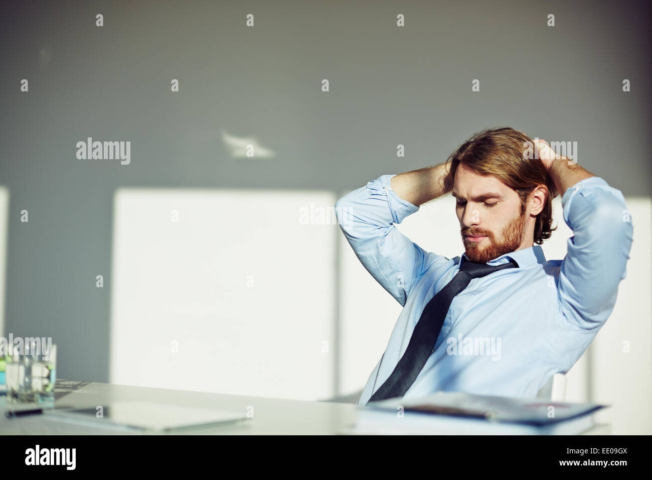 Office worker taking a pause at his workplace Stock Photo - Alamy