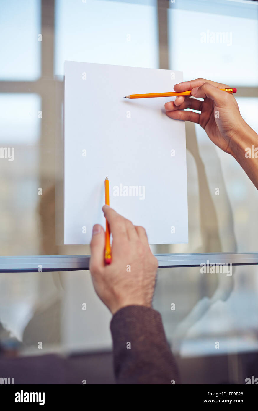 Male hand with pencil pointing at blank paper on noticeboard Stock ...
