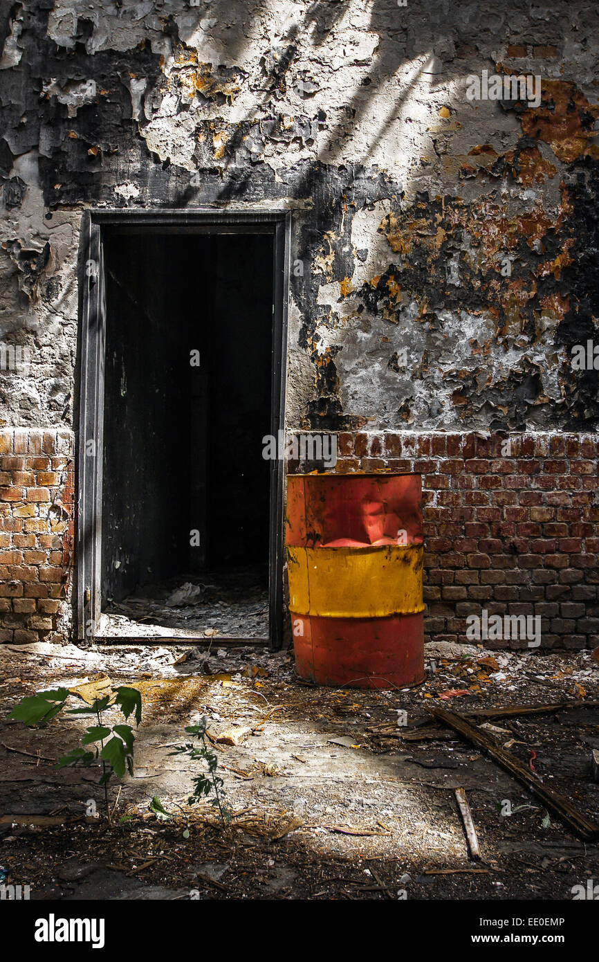 Damaged oil drums in industrial interior closeup Stock Photo - Alamy