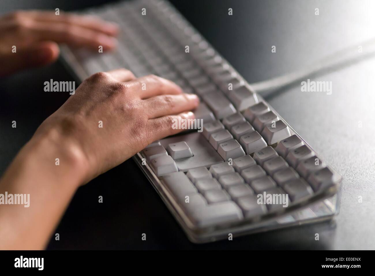 Hands of a woman with keyboard closeup Stock Photo - Alamy