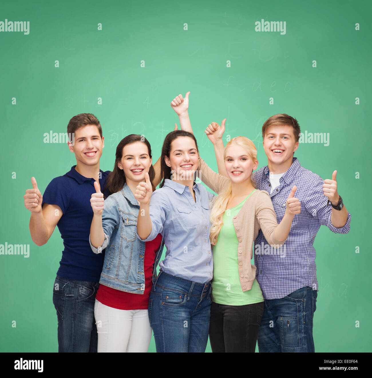 group of smiling students showing thumbs up Stock Photo - Alamy