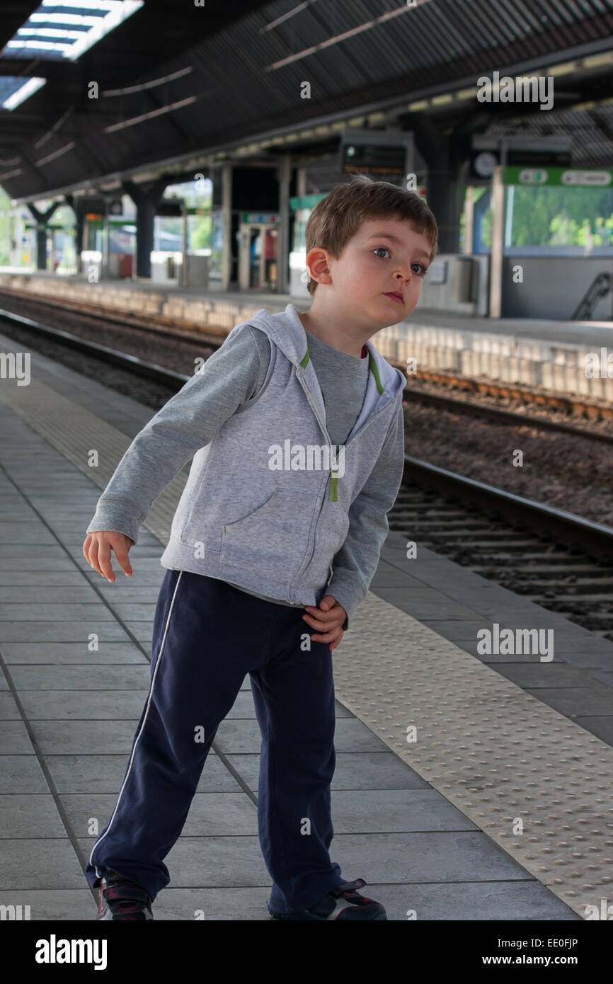 child on the platform waiting for the train Stock Photo - Alamy