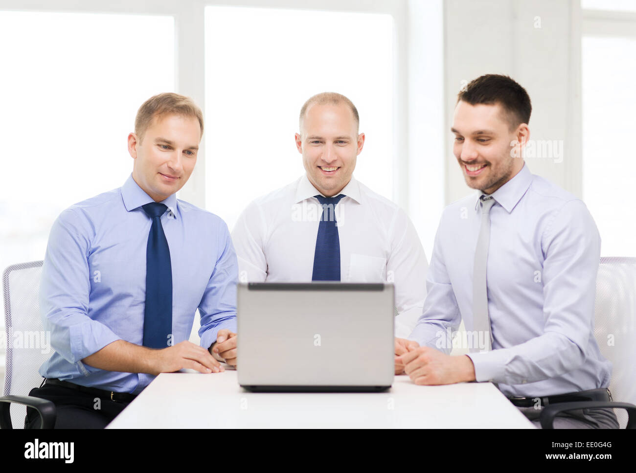 business team working with laptop in office Stock Photo - Alamy