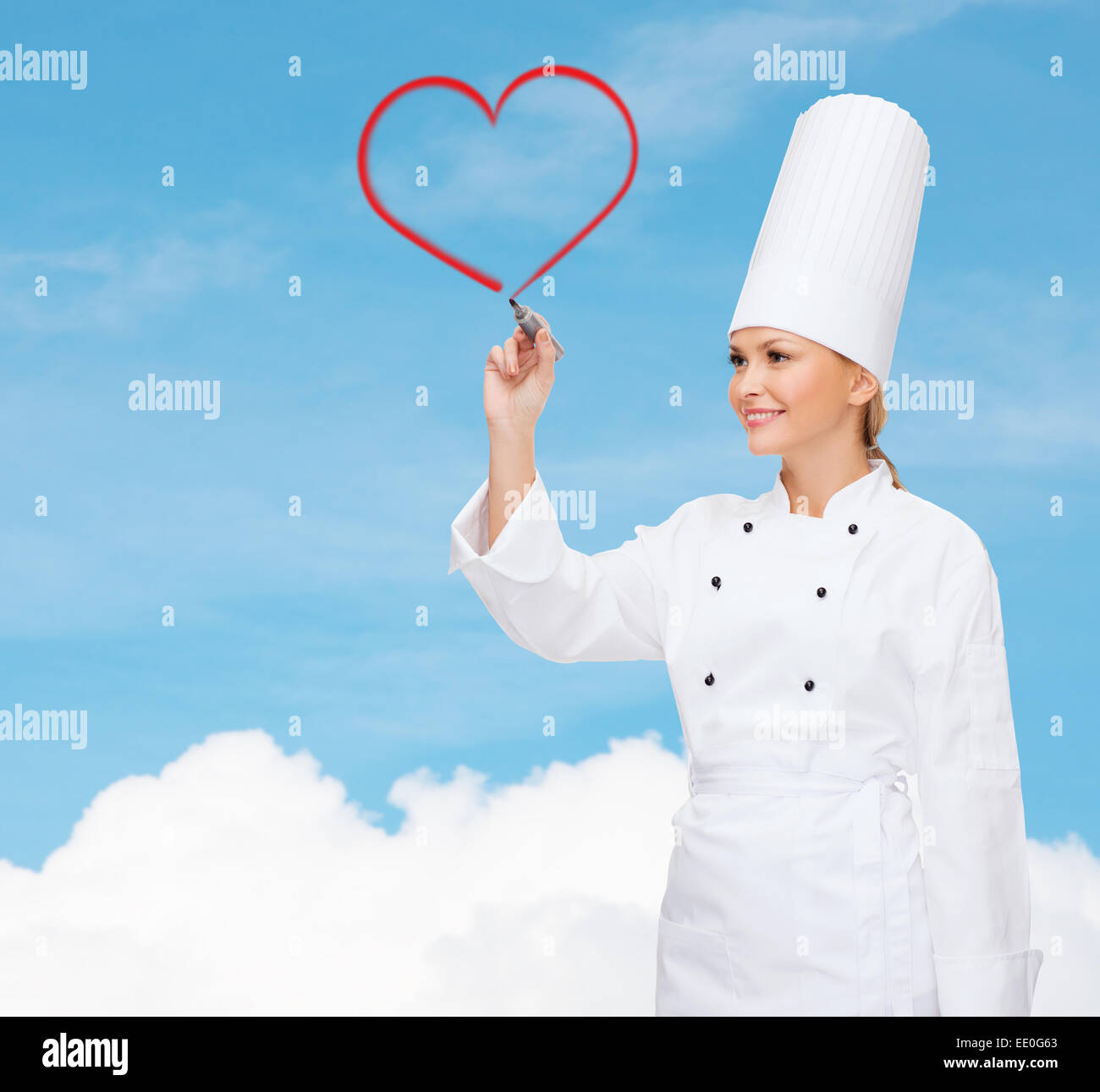 smiling female chef writing something on air Stock Photo - Alamy