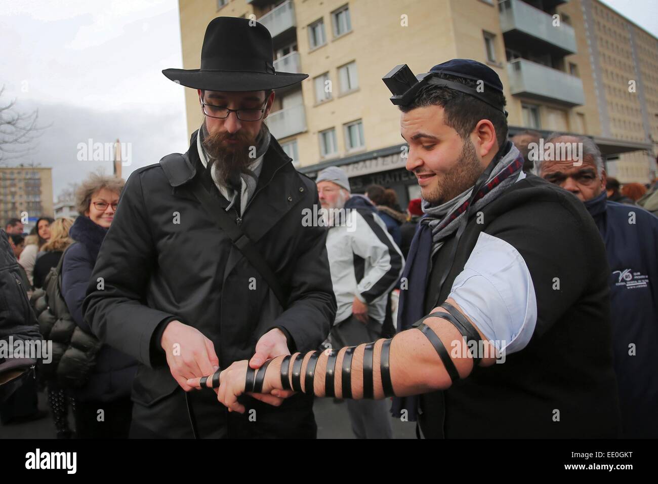 Paris, France. 12th Jan, 2015. Two Orthodox Jews lay tefillin for ...