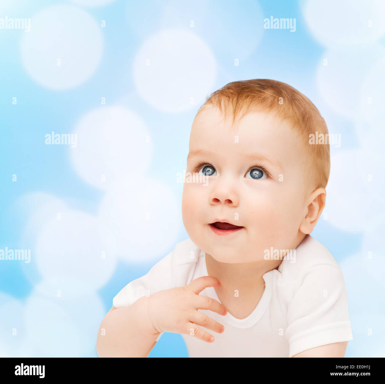 smiling baby lying on floor and looking up Stock Photo - Alamy