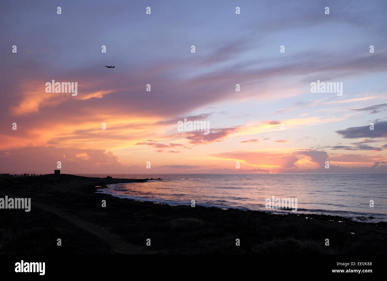 Evening shot at Pafos, Cyprus, with plane flying west to east Stock ...