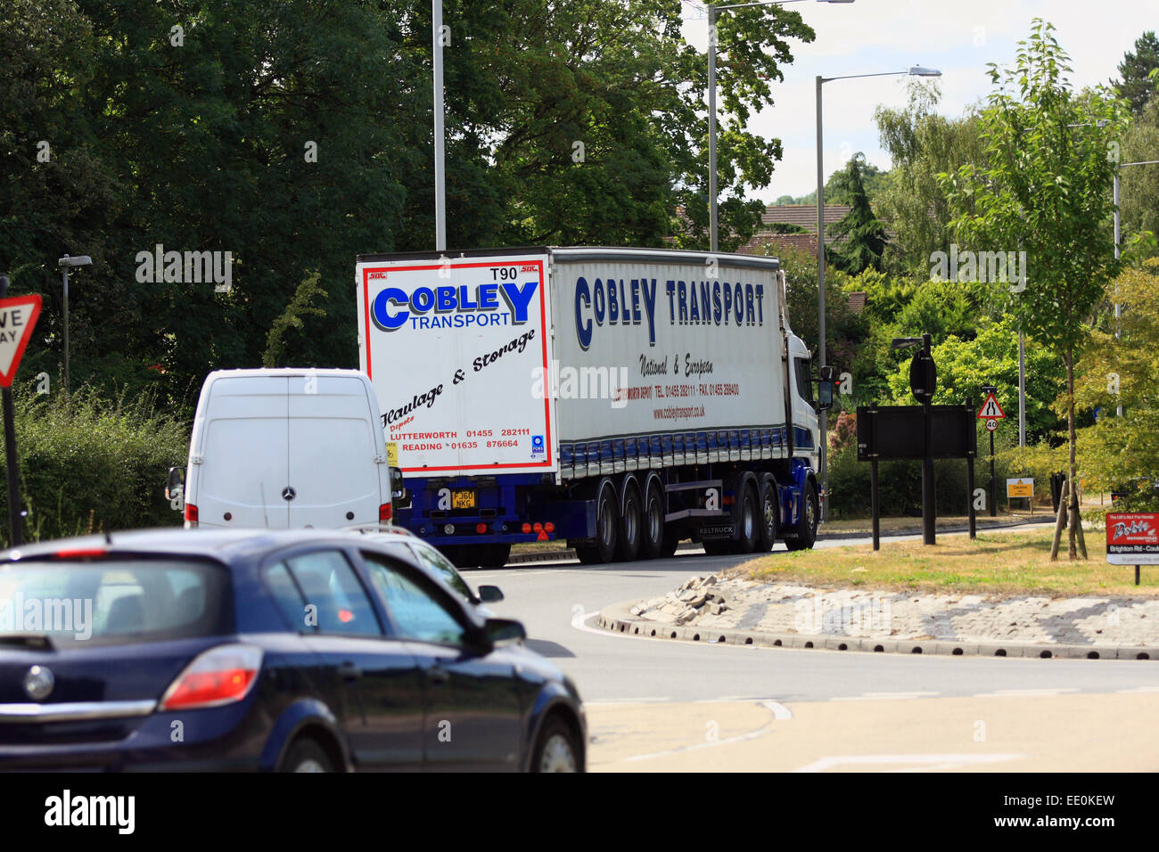 Traffic traveling around a roundabout in Coulsdon, Surrey, England ...