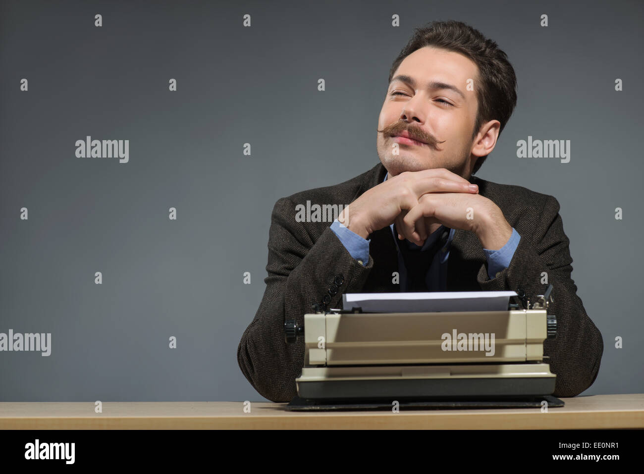Inspired young author typing Stock Photo - Alamy