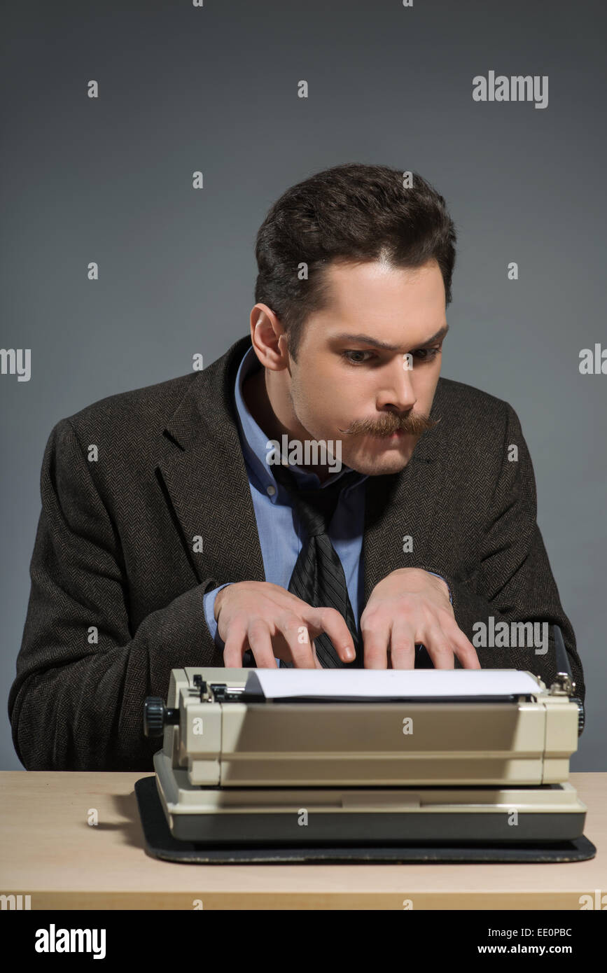 Inspired young author typing Stock Photo - Alamy