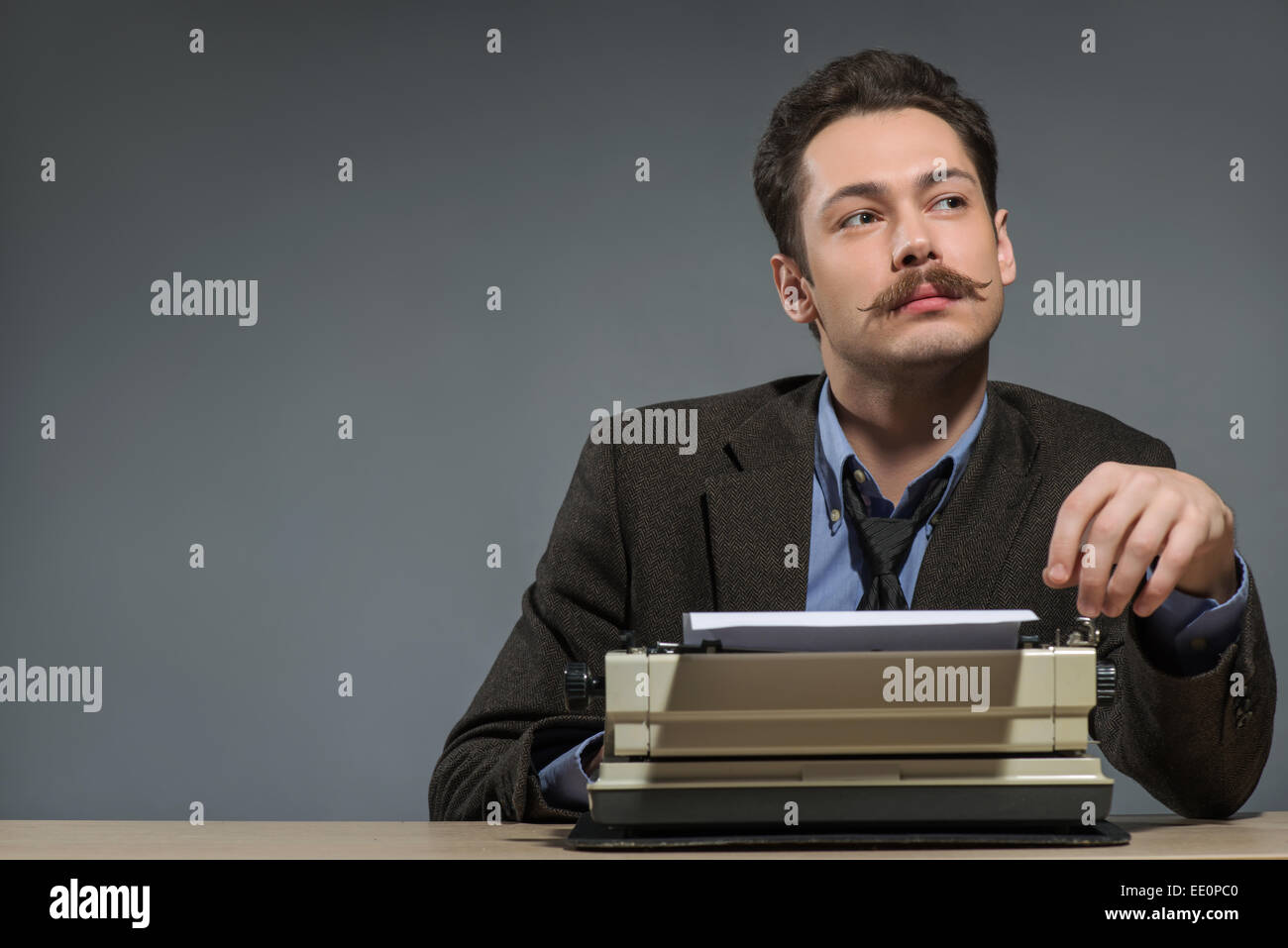 Inspired young author typing Stock Photo - Alamy