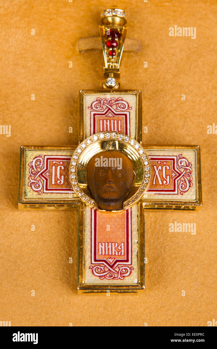 cross with the icon in the center on a brown background Stock Photo - Alamy